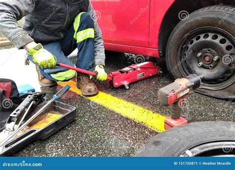 Guy Fixing Flat Tire With Tools Stock Image Image Of Boots Elbox
