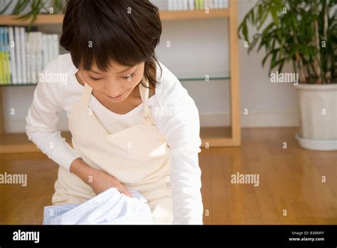 Housewife Folding Laundry Stock Photo Alamy