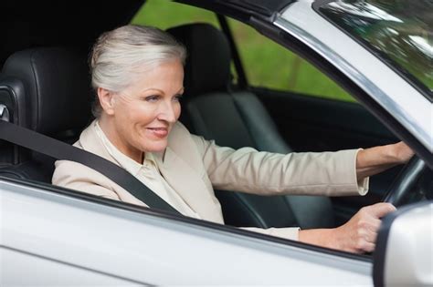 Premium Photo Smiling Businesswoman Driving Classy Car