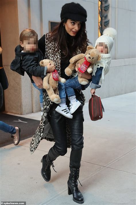 Amal Clooney Holds Her One Year Old Twins Ella And Alexander Daily