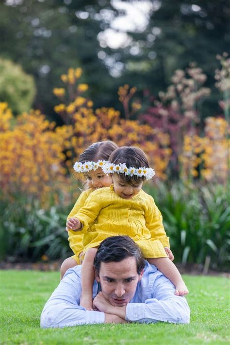 Sweet Girls Having Fun Outdoors With Their Father Fatherhood Concept