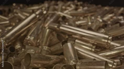 Close Dolly Of Fired Shell Cases Of Several Calibers And Firearms Stock