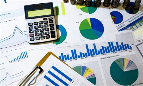 Analyzing Income Charts And Graphs With Calculator Close Up Business Financial Analysis And
