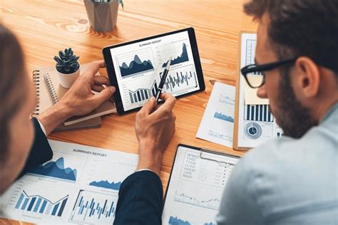 Premium Photo Busy Analyst Team In Office Analyzing Financial Data Analysis By Tablet Entity