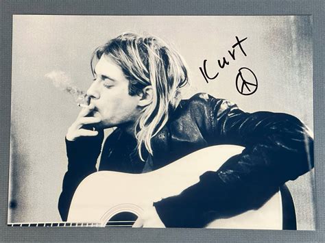 Kurt Cobain Nirvana Autographed Photograph Auction