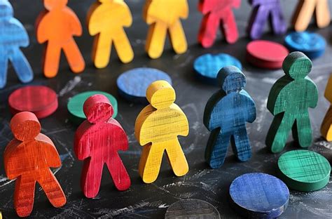 Colorful Paper Cutout Figures On Blue Background Abstract Human Shapes Diversity Equality