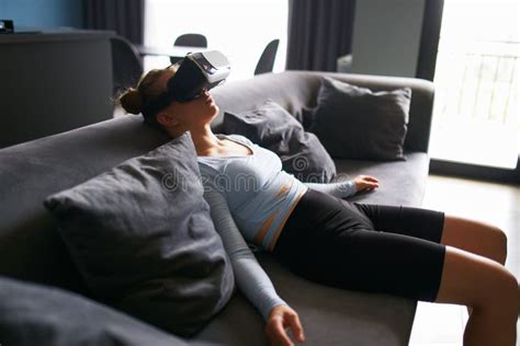 Robot Like Futuristic Doll Woman In Virtual Reality Goggles Interface On Head Enters Metaverse