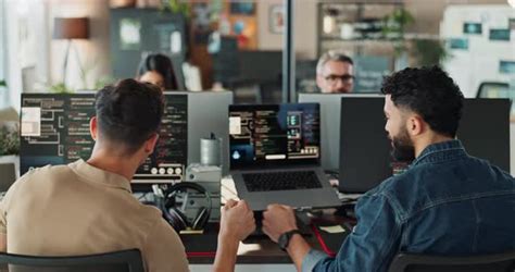 Coding Computer Screen And Fist Bump With Business People In Office