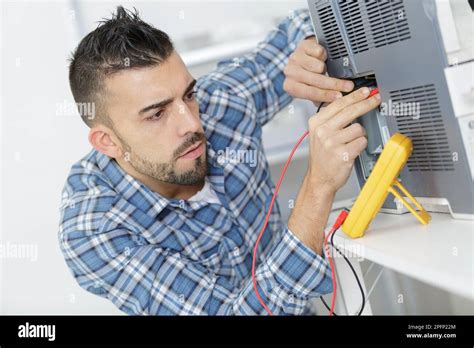 Engineering Babes Working Using A Voltage And Current Tester Stock Photo Alamy