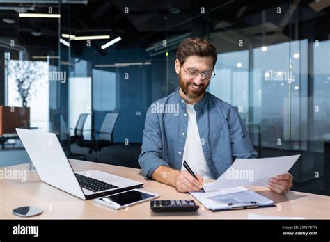 mature businessman in shirt doing paperwork man working with documents