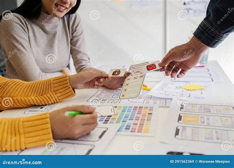 team of ui ux web designer are working together to develop mobile