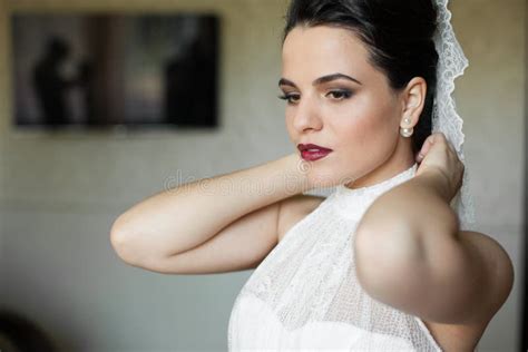 Beautiful Brunette Bride Smiling And Posing In Hotel Room Closeup Stock