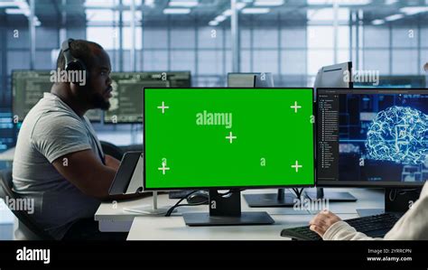 It Support Workers In Ai Data Center Coding On Green Screen Computers