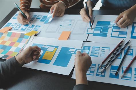 Premium Photo Close Up Ux Developer And Ui Designer Brainstorming About Mobile App Interface