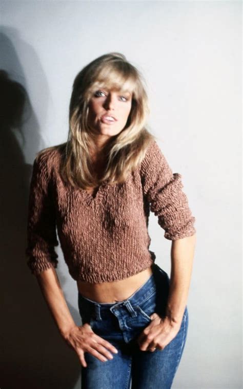Farrah Fawcett Wearing A Brown Sweater And Blue Jeans 1970s