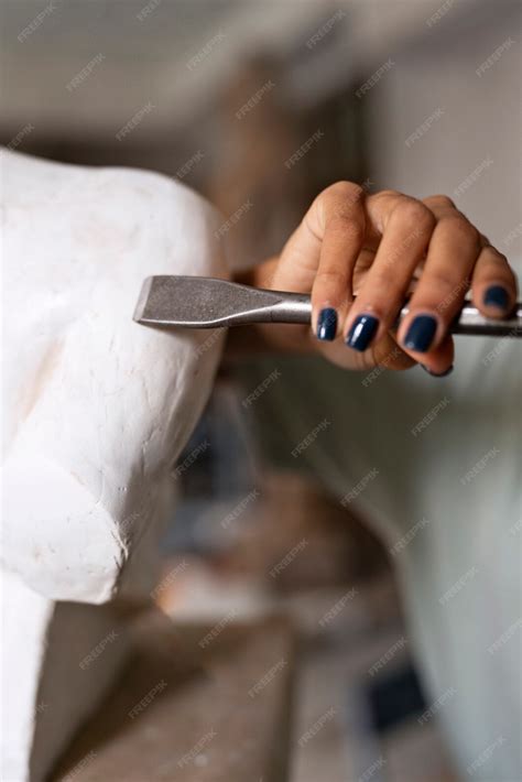 Free Photo Front View Hand Holding Chisel