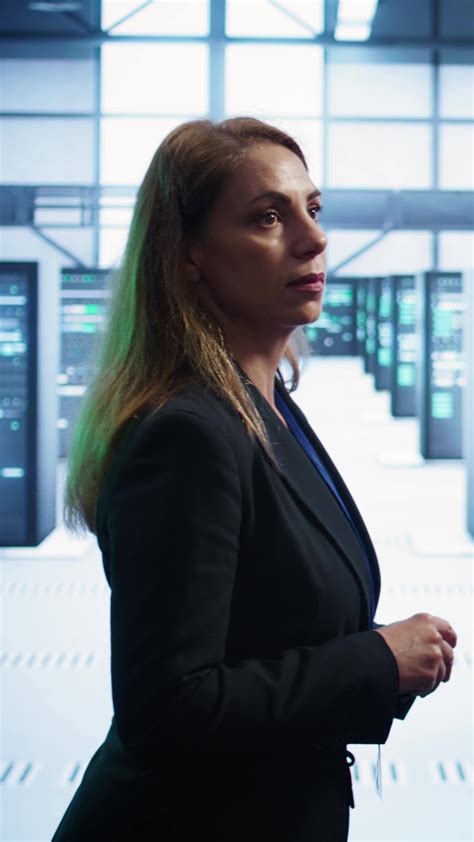 Vertical Engineer Walking In Data Center Workspace Monitoring Systems