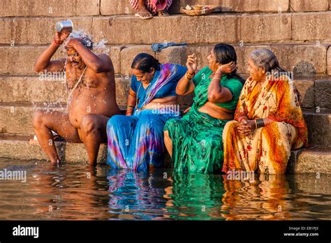 Hindu Pilgrims Bathing In The Holy River Ganges Varanasi Uttar
