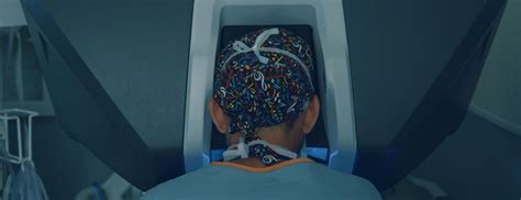 Surgeon Looking Into Robotic Surgery Control Console