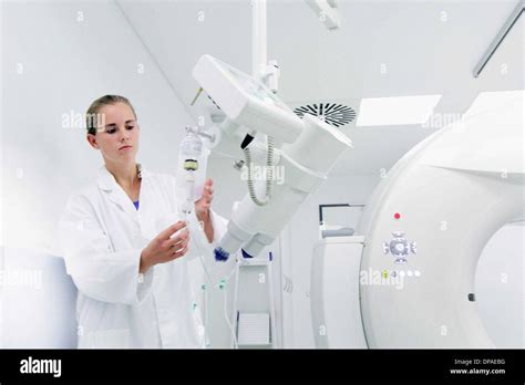 Female Doctor Checking Ct Scanner Stock Photo Alamy