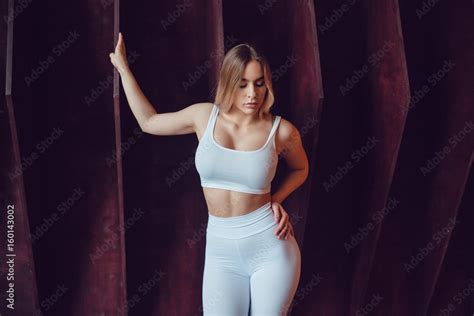 Sexy Blonde Woman With Huge Breast In A White Top And Leggings Mock Up