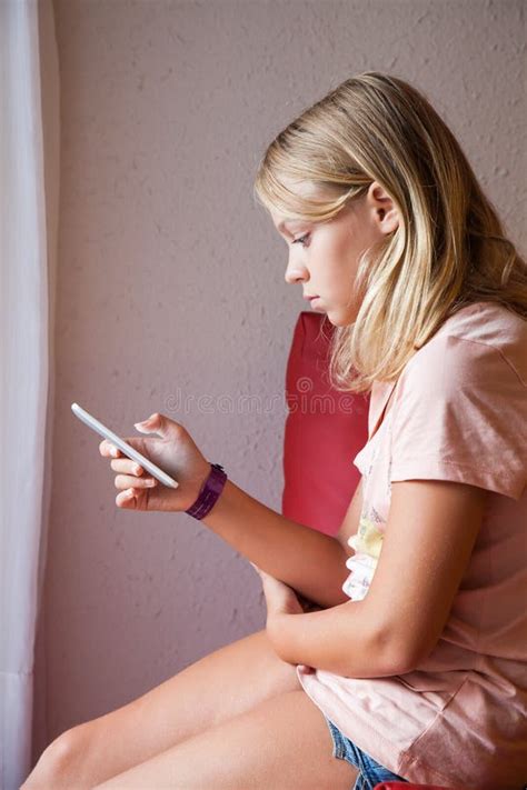 Cute Caucasian Blond Teenage Girl Using Smartphone Stock Image Image
