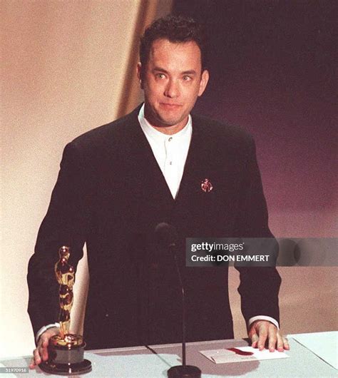 Us Actor Tom Hanks Holds His Oscar 27 March As He Speaks To The News