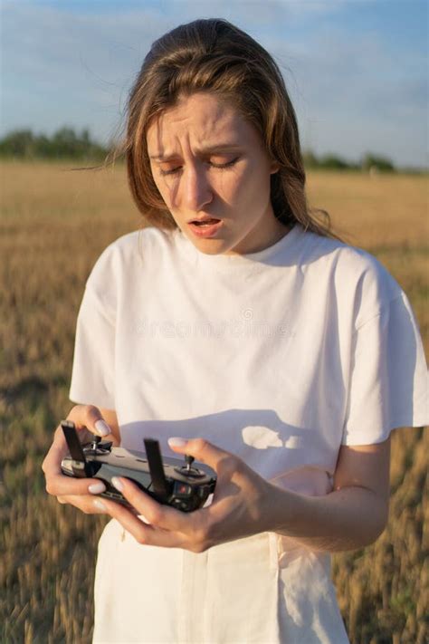 Drone Control Female Pilot Tries To Control Quadcopter In Flight Stock