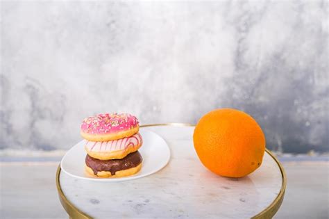 Premium Photo | Donat cake on a colored background round