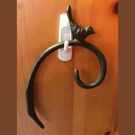 curl hook with bird beyond the arbour
