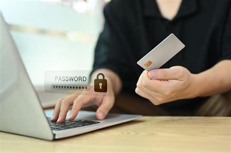 Premium Photo Cropped Shot Of Man Holding Credit Card And Entering Verification Code Login To