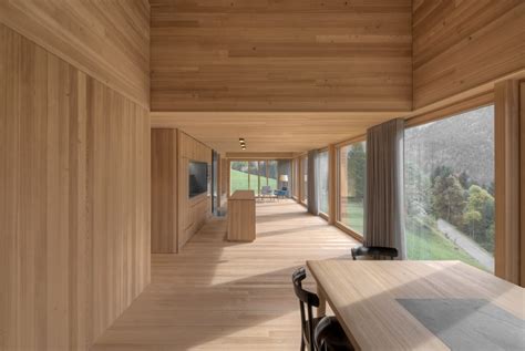 Bernardo Bader Perches Larch Clad Home Over Concrete Plinth In Austrian