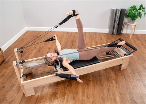 Dvd Pilates Reformer Exercise Machine Group Of Women Practicing On