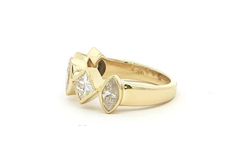 Bezel Set 5 Stone Marquise And Princess Cut Diamond Ring In Yellow Gold