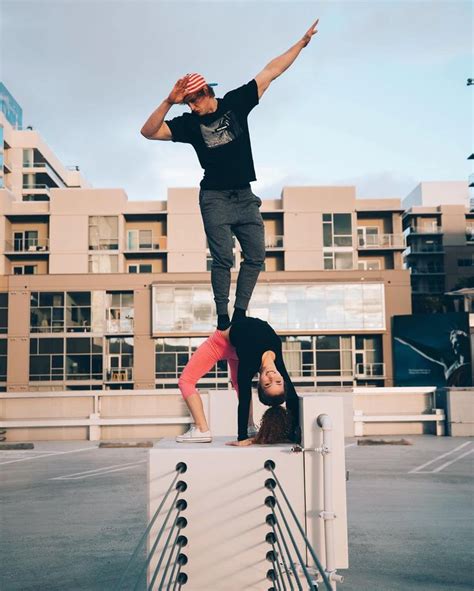 two people standing on top of each other