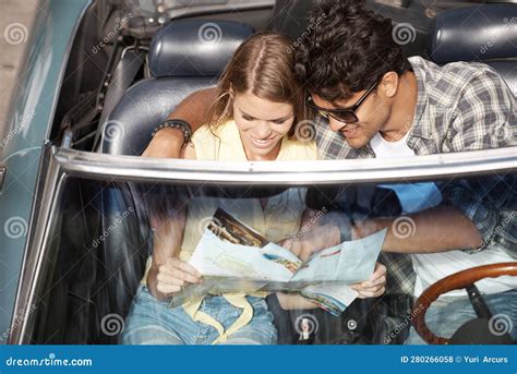 Lets Go Here An Affectionate Young Couple Riding With The Top Down In