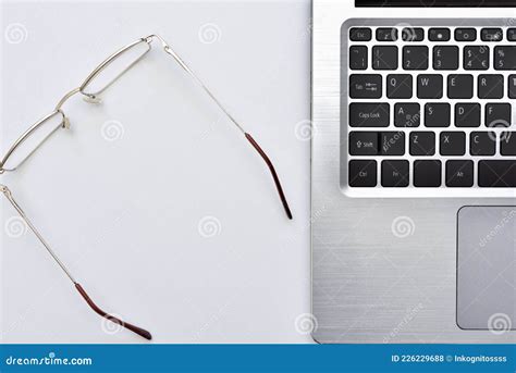Top View Of Glasses And Laptop Computer Keyboard Vision Problems At