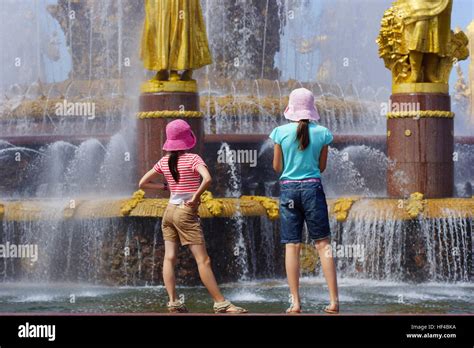 Girls At The Fountain In The Park At Vdnkh On A Hot Summer Day Russia