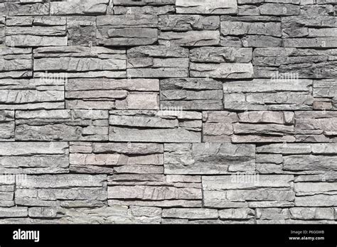 Grey Stone Tiles With Rough Surface At House Wall Stock Photo Alamy