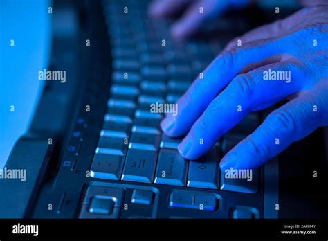 A Man Works At A Computer Hands Of A Man On The Keyboard Close Up Programmer Or Hacker Side