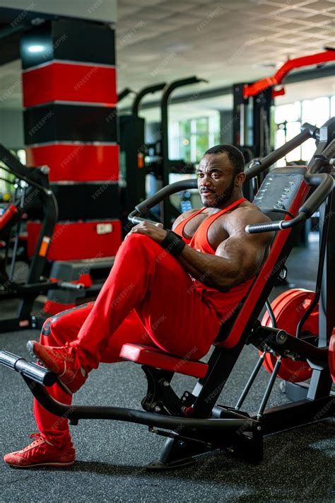 Premium Photo Power Bodybuilder Man Training In The Gym Handsome