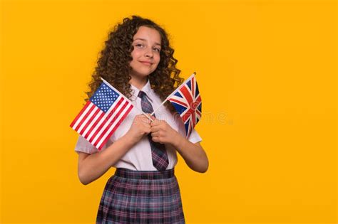 Girl With Slight Smile Holding Usa And Uk Flags Stock Image Image Of
