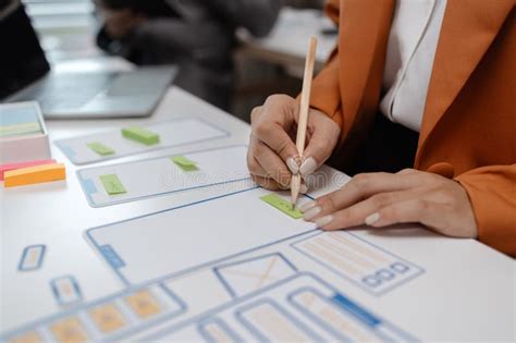 Ux Developer And Ui Designer Brainstorming About Mobile App Interface Wireframe Design In The