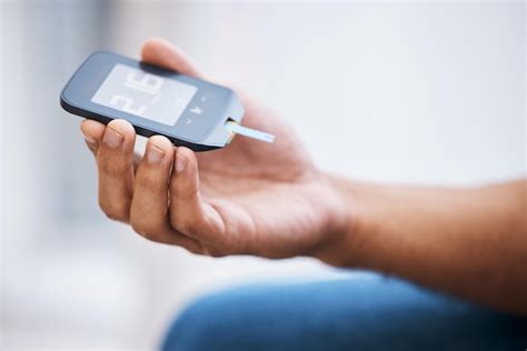 Premium Photo Hand Diabetes And Measurement With A Man In His Home Holding A Blood Glucose