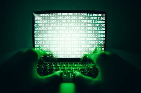 Premium Photo Hacker Using The Laptop Computer To Coding Virus Or