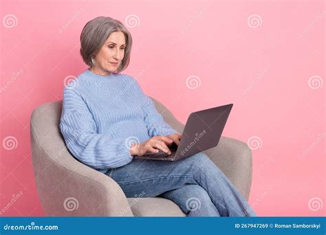Photo Of Serious Confident Retired Woman Freelancer Entrepreneur Professional Programmer Typing