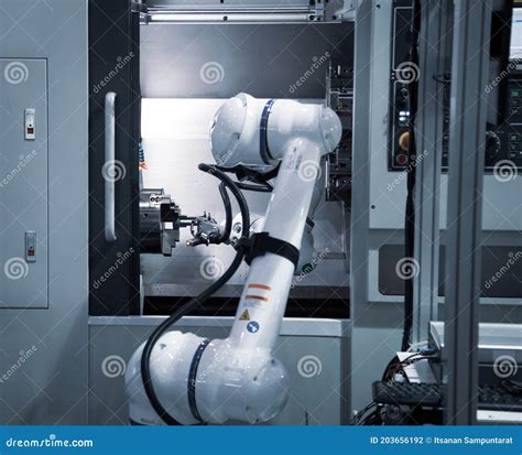 Robot Loading Workpiece To CNC Machine Stock Photography