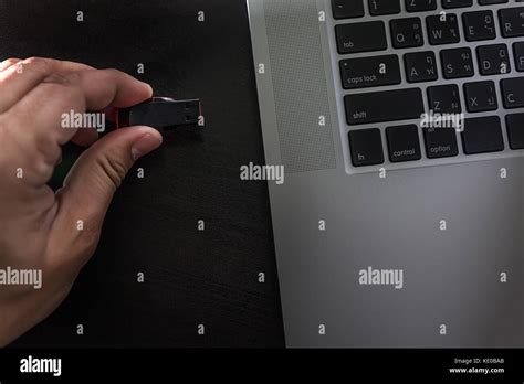 USB Flash Cards And Thumb Drive Or Stick Virtual Memory Storage With USB Cable Into Slot Laptop