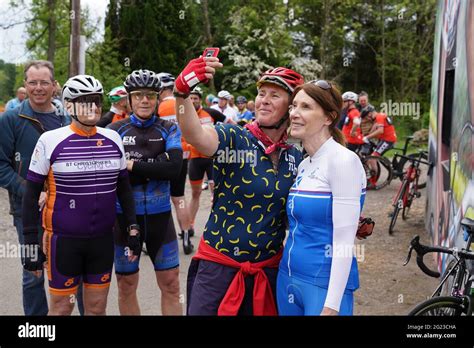Philippa York Poses For Photos With Other Cyclists In Front Of A