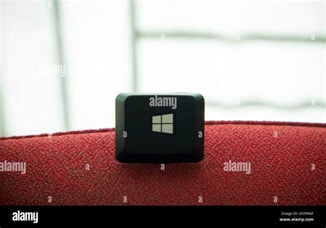Windows Start Button Of A Keyboard In Front Of A Window On A Red Surface Stock Photo Alamy